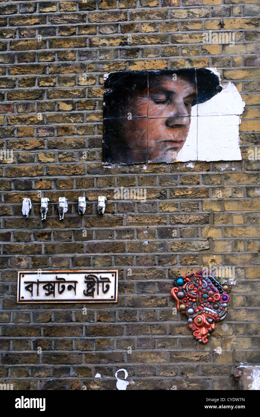 Multicultural wall: street sign in Bengali script and street art by ...