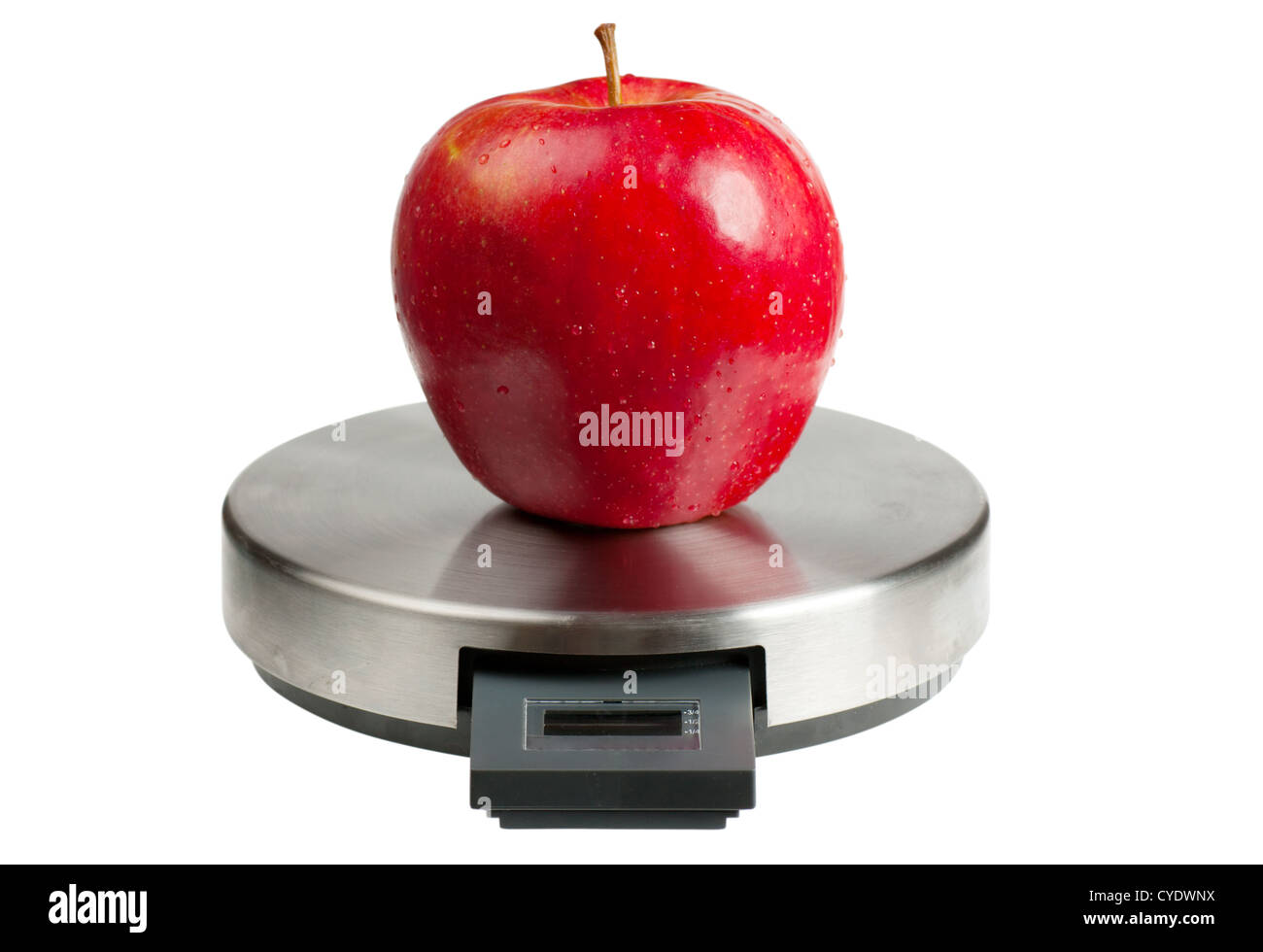 Big red apple on a scales isolated over white background. Diet concept ...