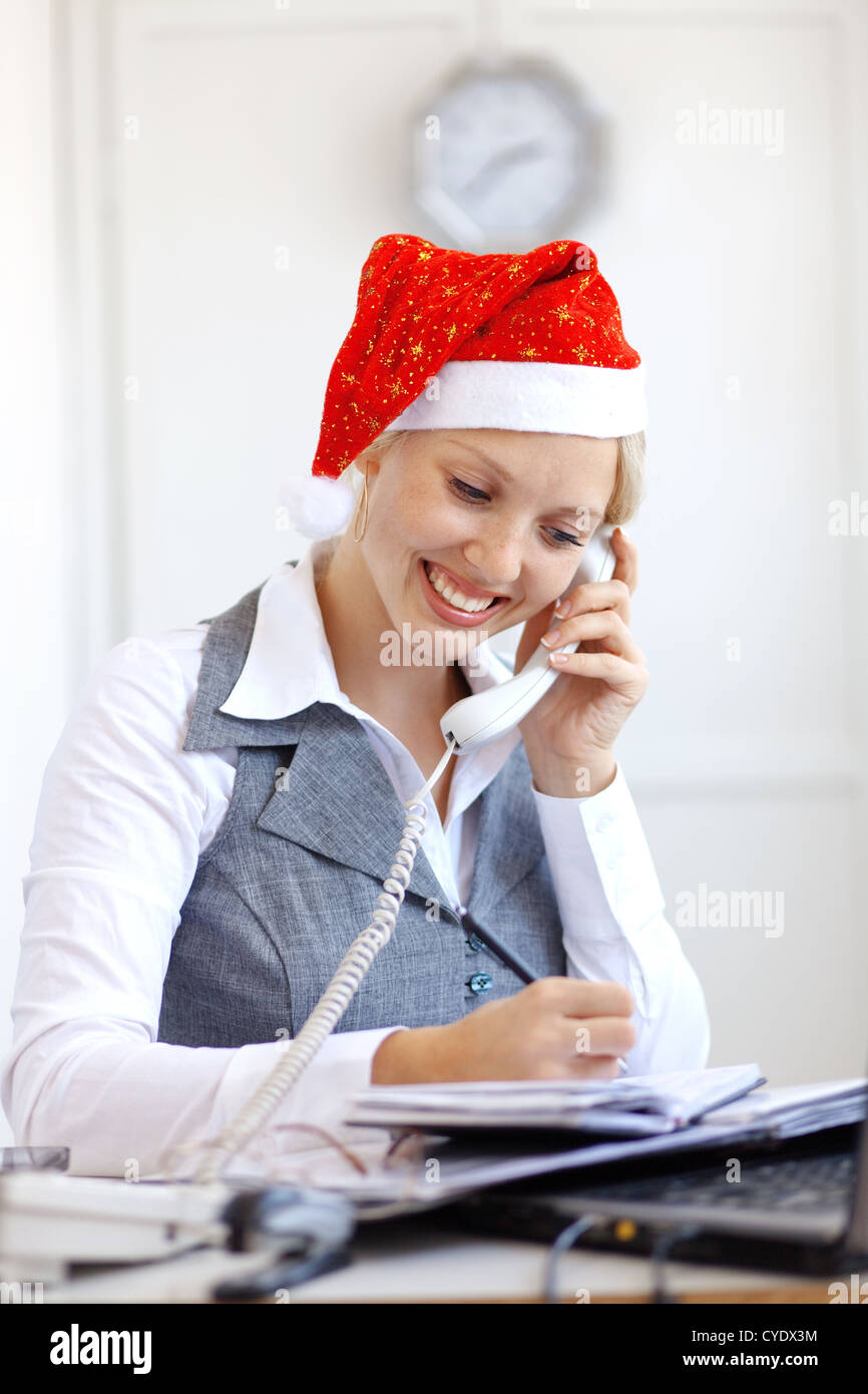 Santa helper working in office Stock Photo - Alamy