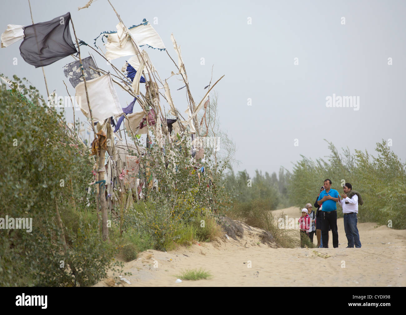 Uyghur Family At Imam Asim Tomb In The Taklamakan Desert, Xinjiang ...