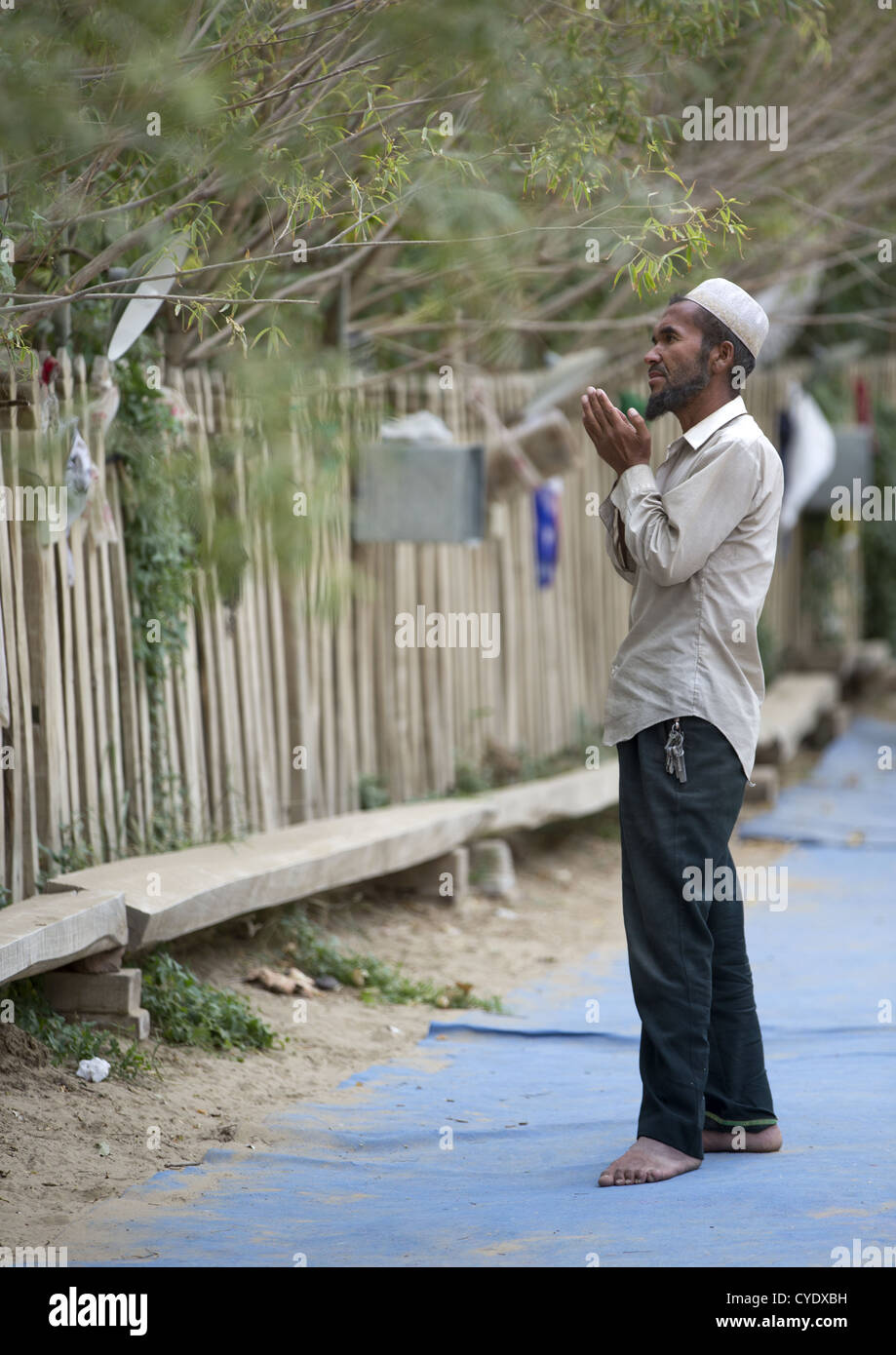 Man Praying At Imam Asim Tomb In The Taklamakan Desert, Xinjiang Uyghur ...