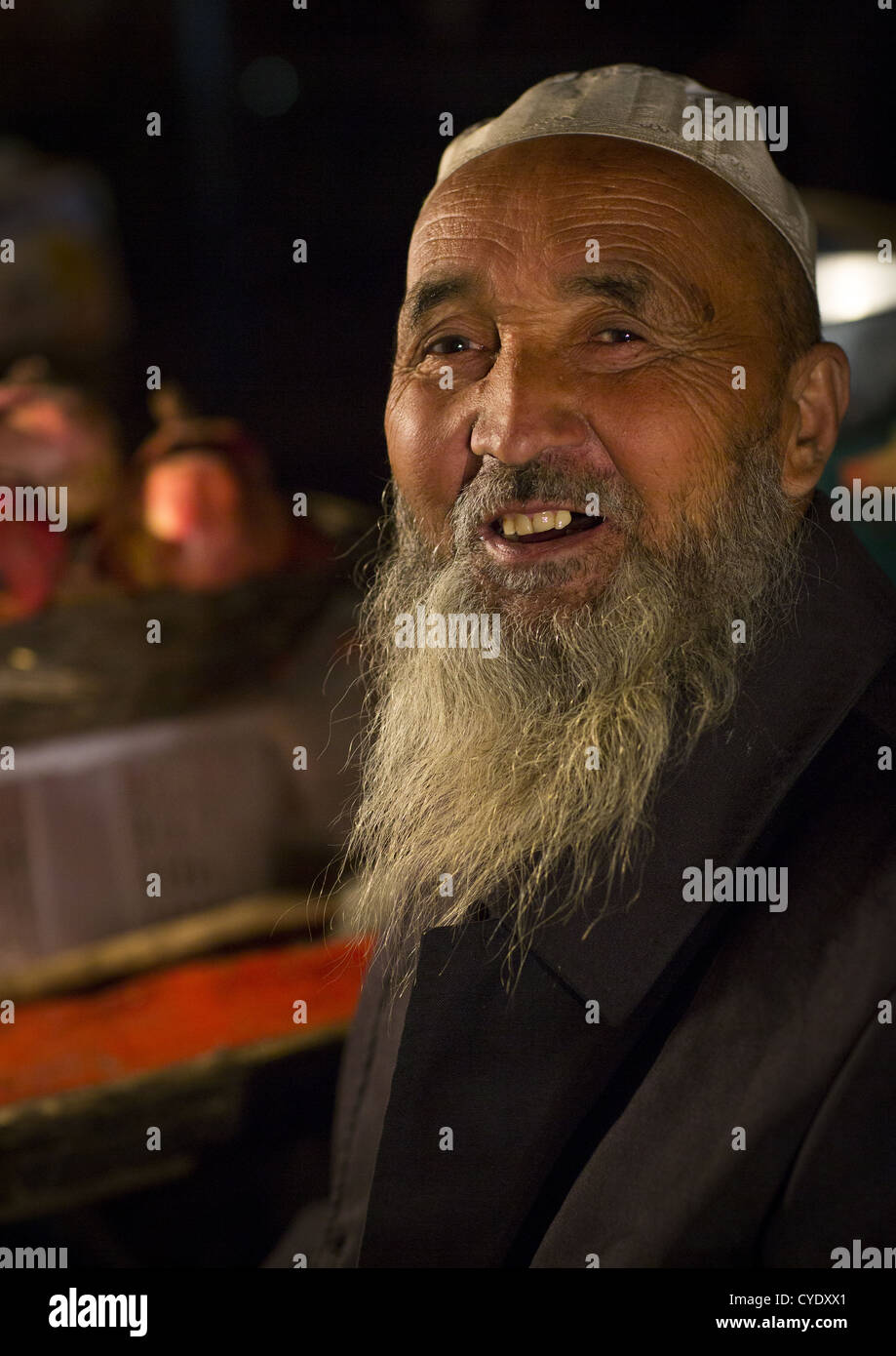 Smiling Uyghur Man In Night Market, Hotan, Xinjiang Uyghur Autonomous ...