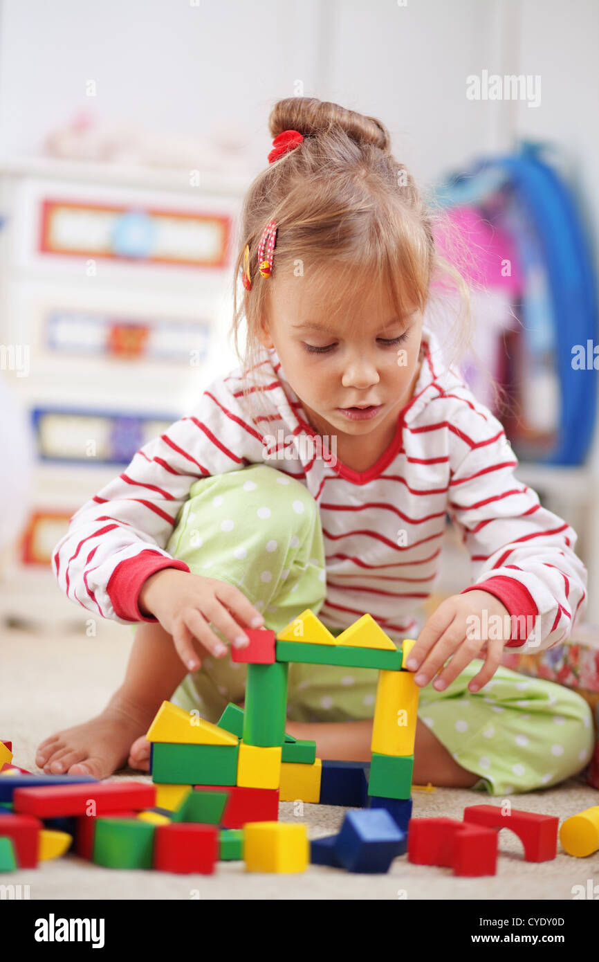 Child playing with blocks in the kindergarten Stock Photo - Alamy