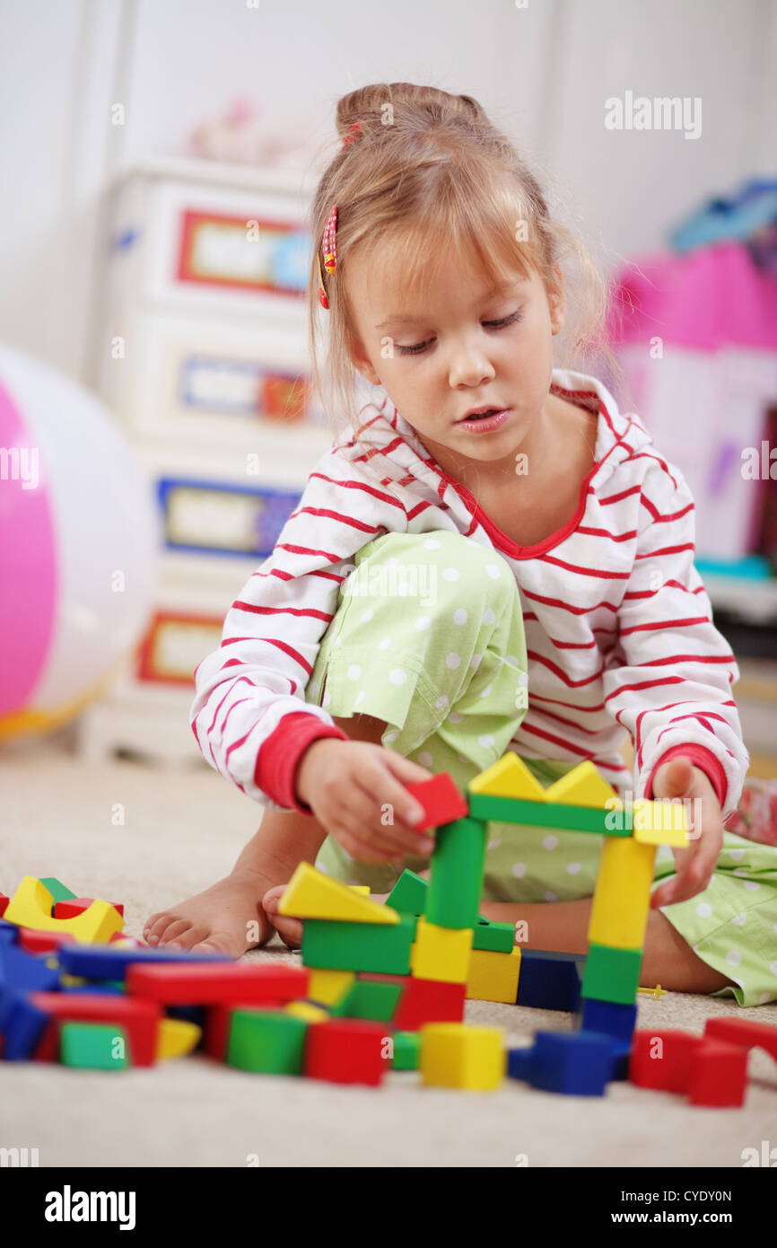 Child playing with bricks Stock Photo - Alamy