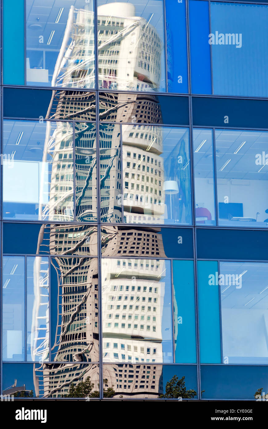 The turning Torso skyscraper reflected in the windows of a nearby ...