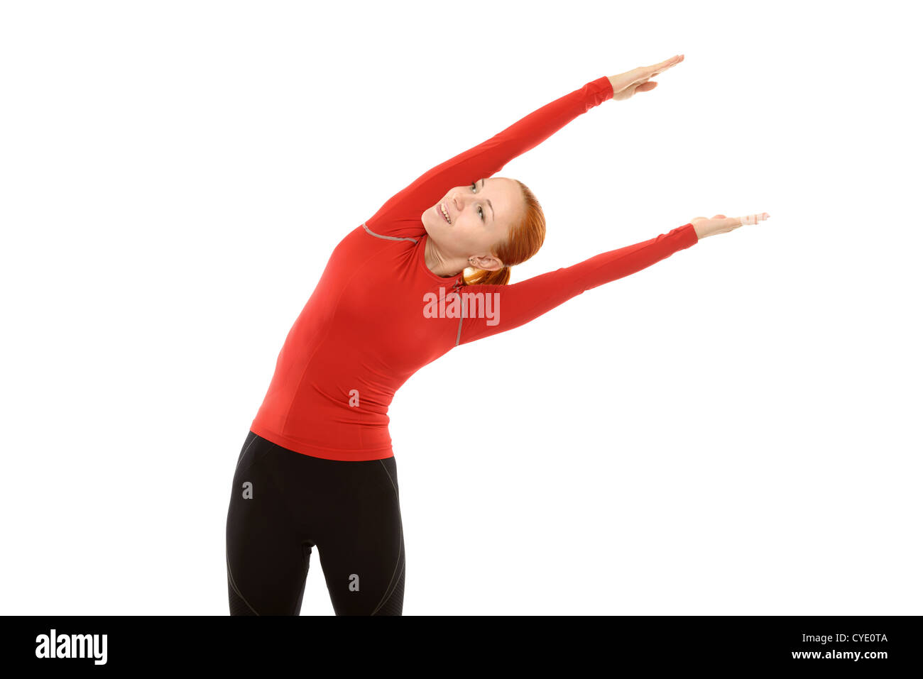 Beautiful young red woman performing fitness exercises over white ...