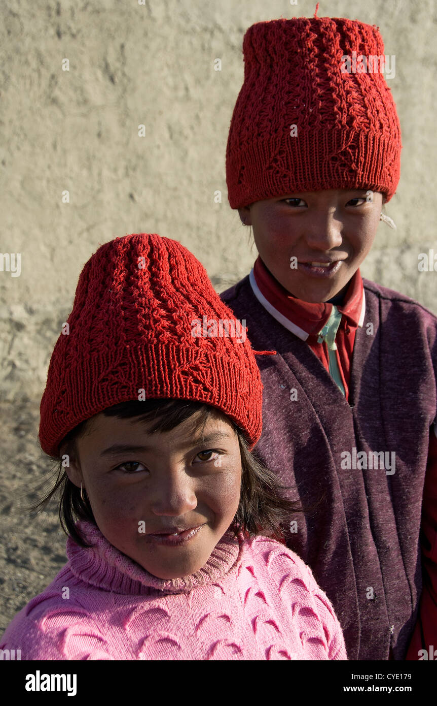 Portrait of two young local girls in the streets of Karakul, Tajikistan ...