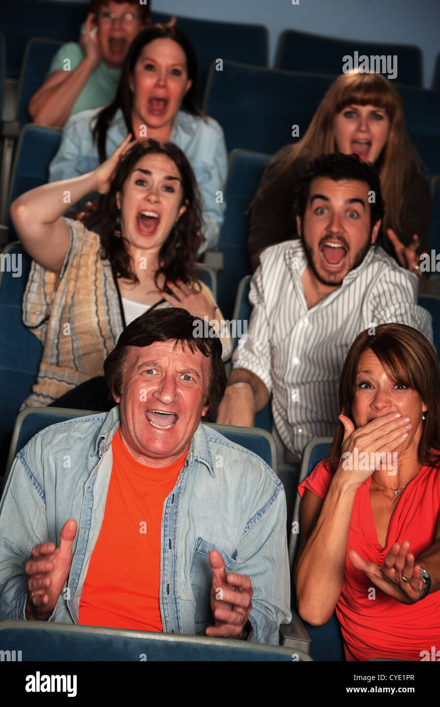 Aghast audience of 7 men and women scream Stock Photo - Alamy