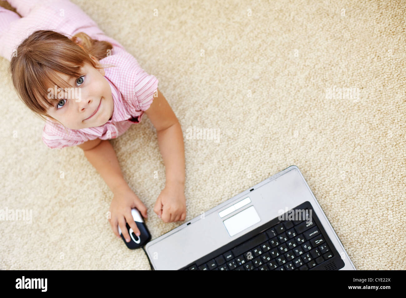 Little cute child working with laptop at home Stock Photo - Alamy