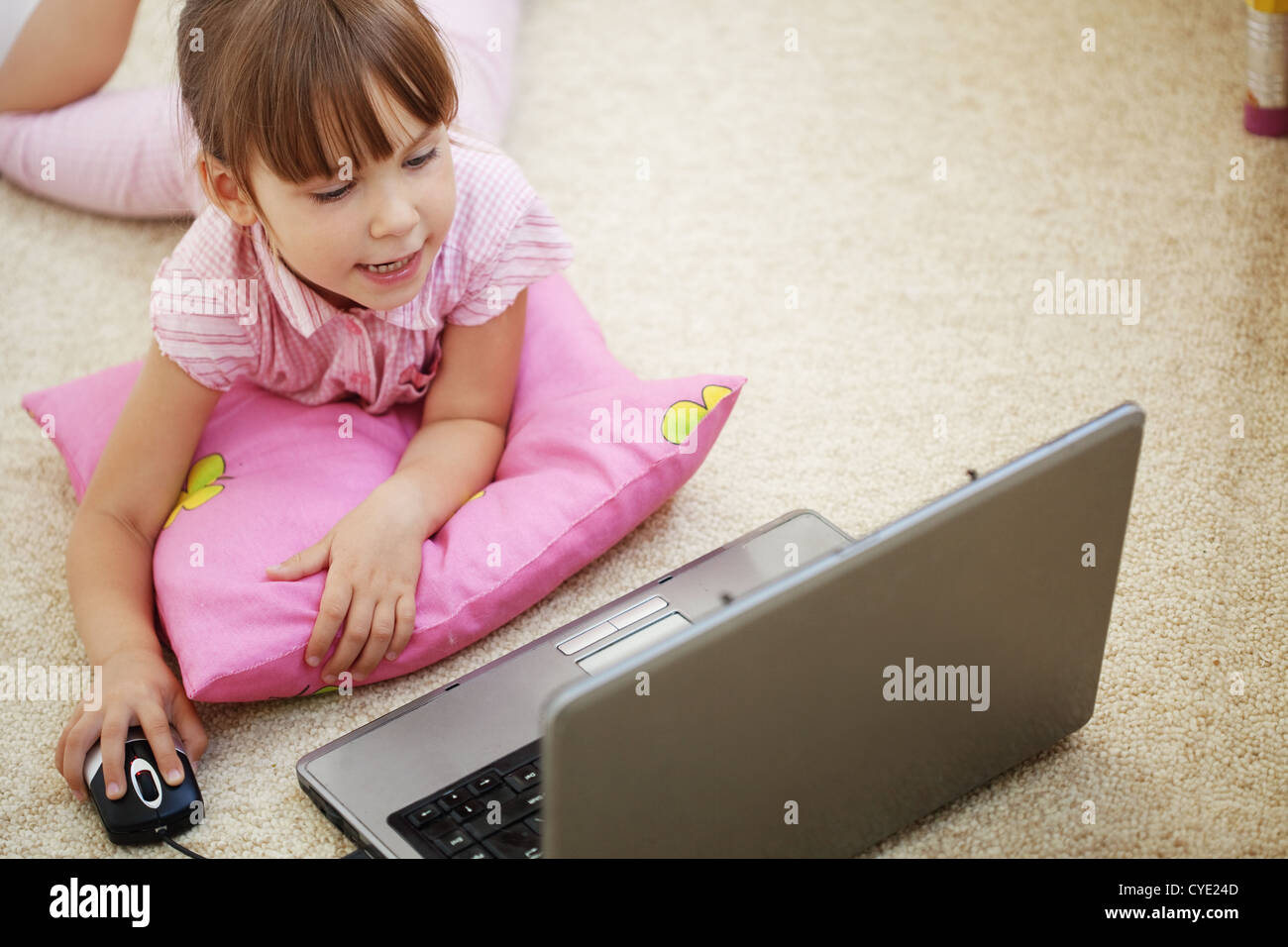Little cute child working with laptop at home Stock Photo - Alamy