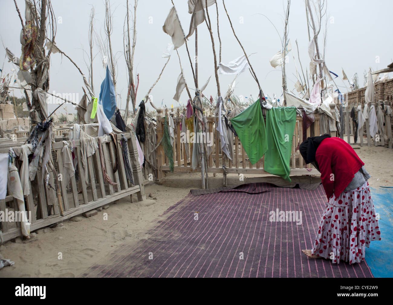 Woman Praying At Imam Asim Tomb In The Taklamakan Desert, Xinjiang ...