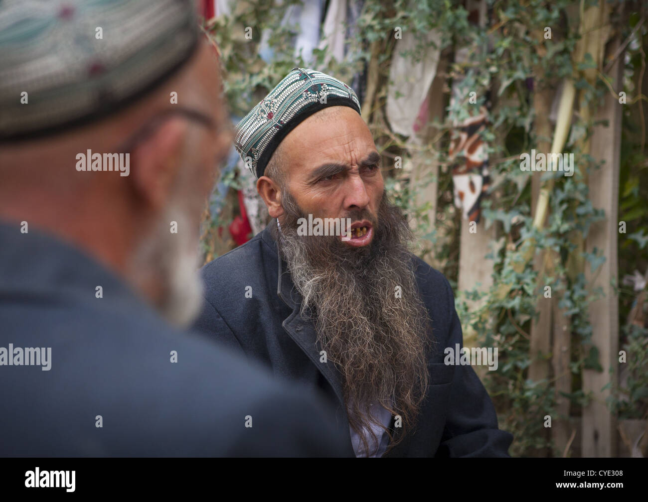 Uyghur Sufi Men Praying At Imam Asim Tomb In The Taklamakan Desert ...