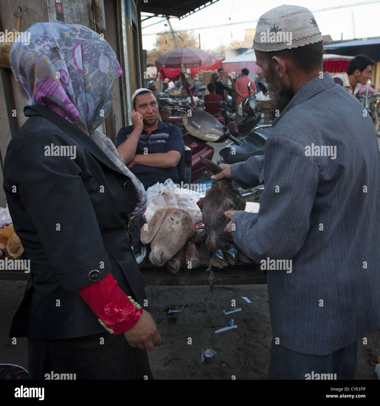 Uyghur Couple Chosing A Mutton Head, Yarkand, Xinjiang Uyghur ...