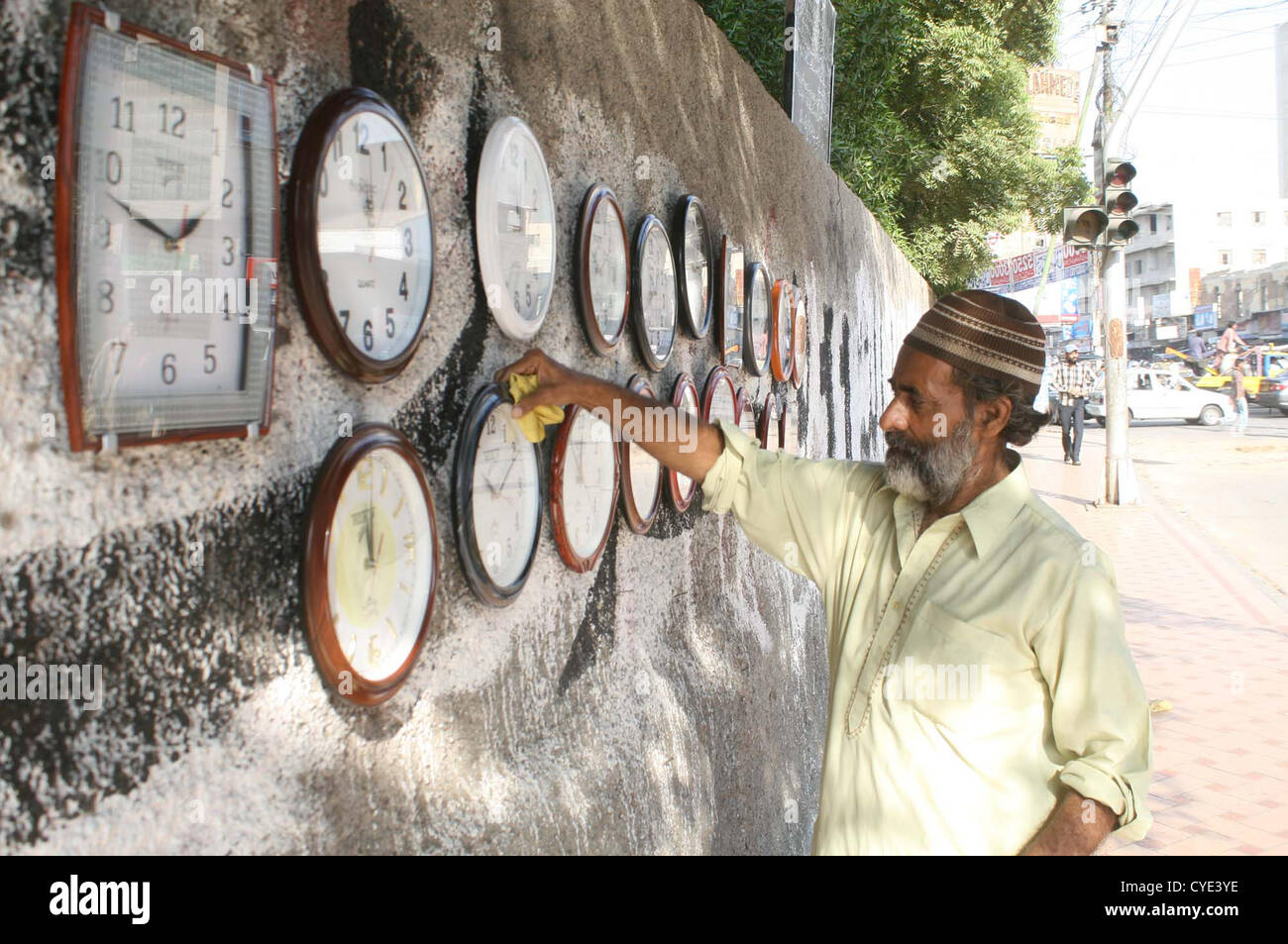 A man sells wall clocks to earn his livelihood for support his family ...