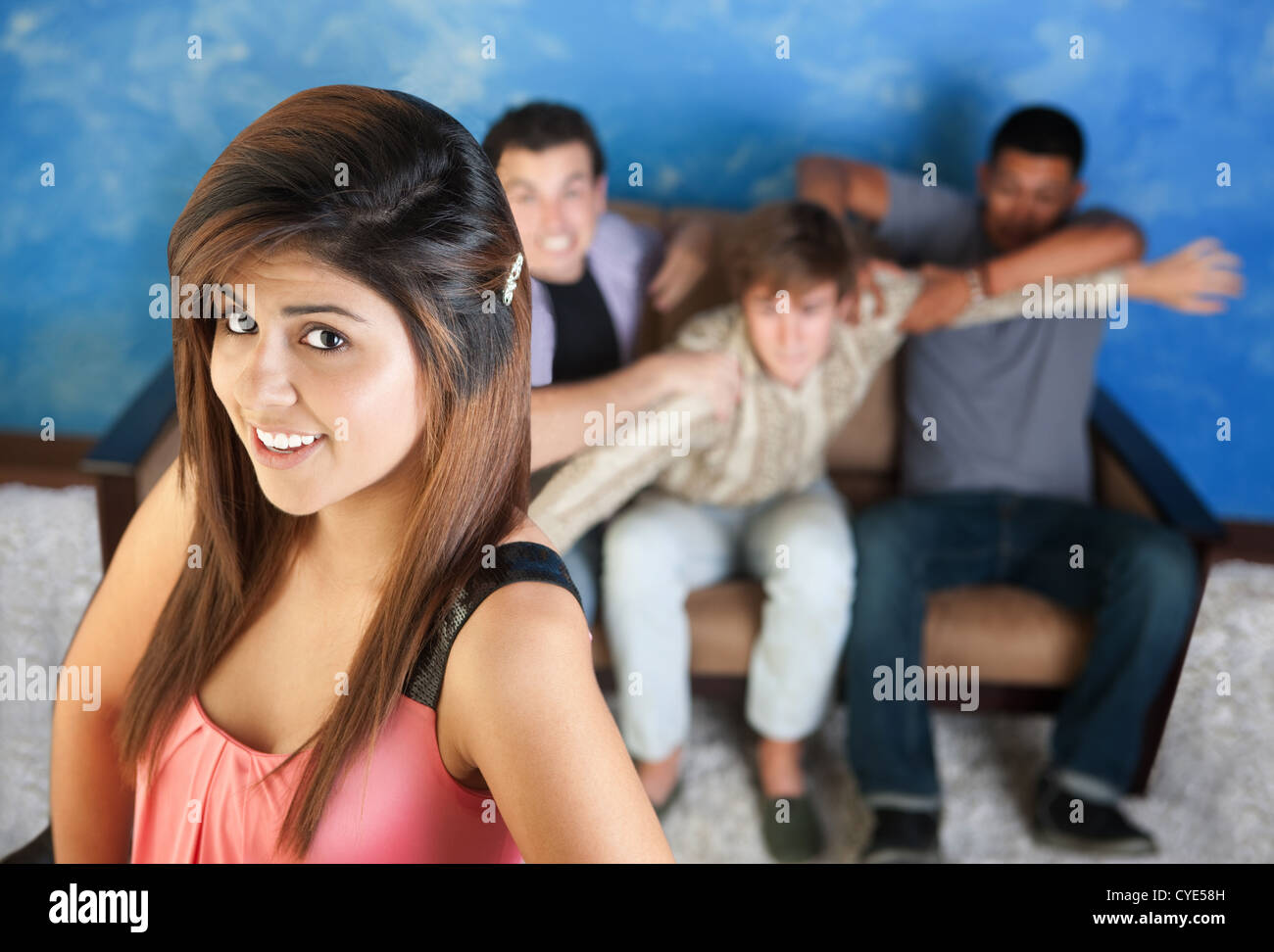 Three young men fight over a pretty teenaged girl Stock Photo - Alamy