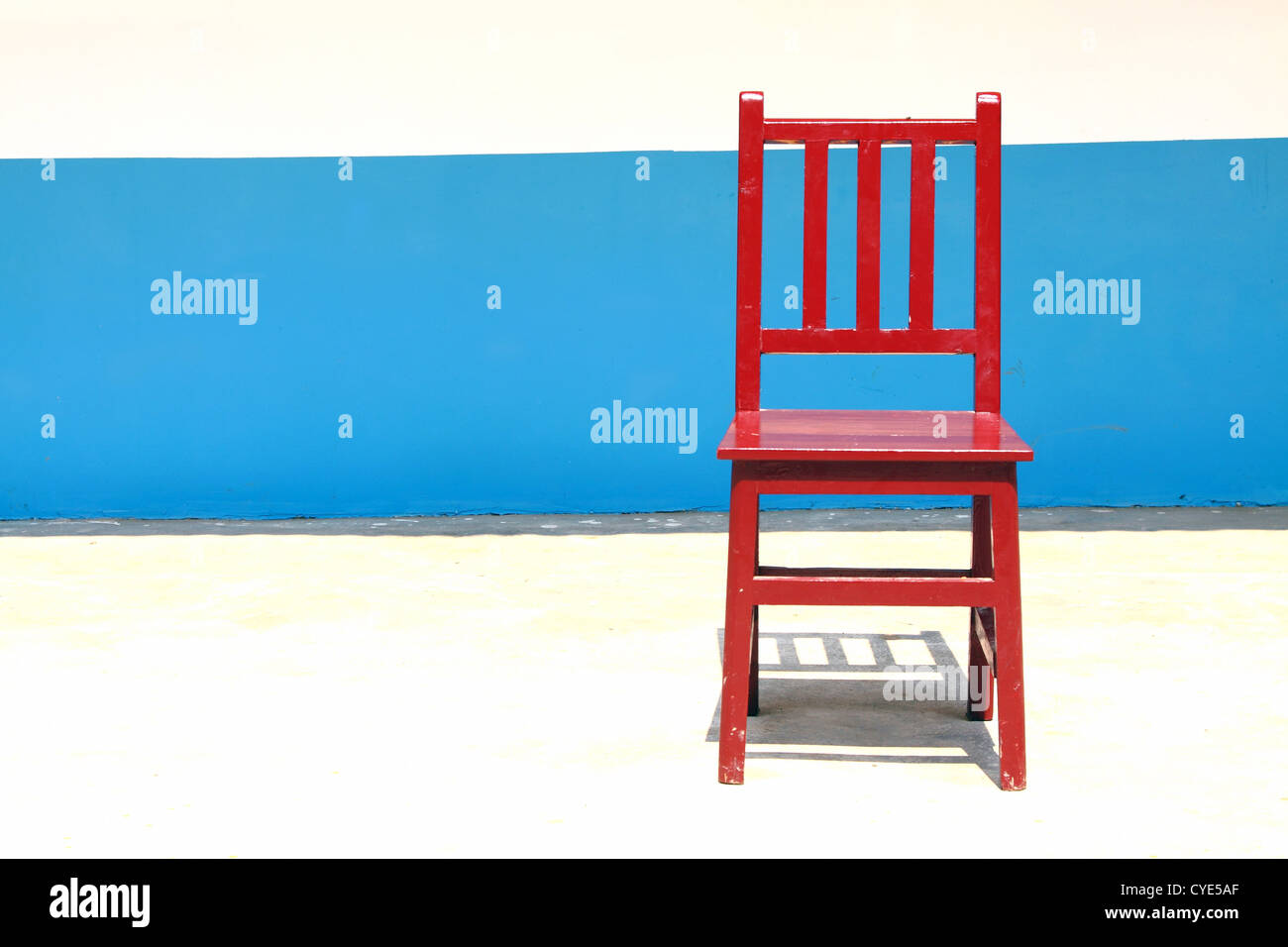 Lonely chair in a bright background Stock Photo - Alamy