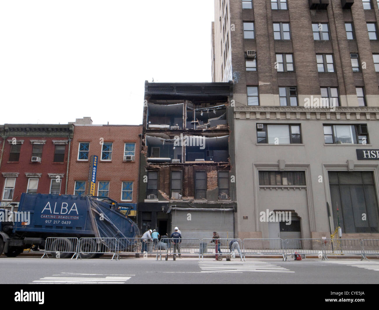 The blown off facade of a Chelsea apartment building from strong winds ...