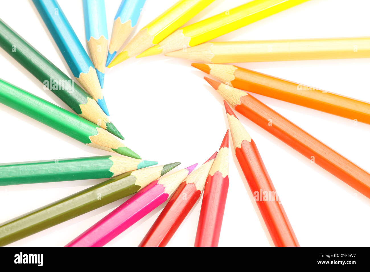 Color pencils in arrange in color wheel colors on white background ...