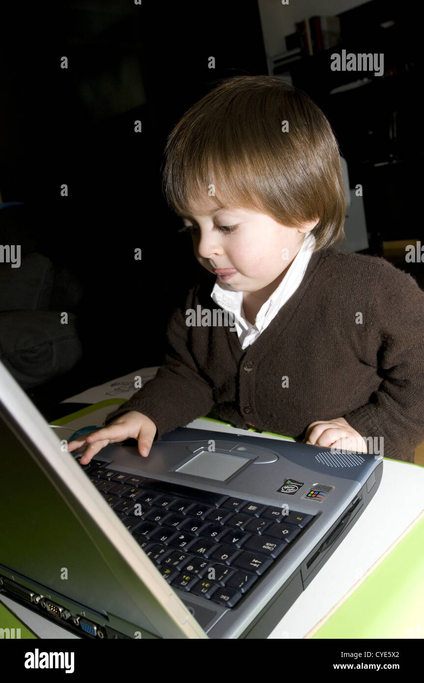 3 years old boy using a laptop Stock Photo - Alamy