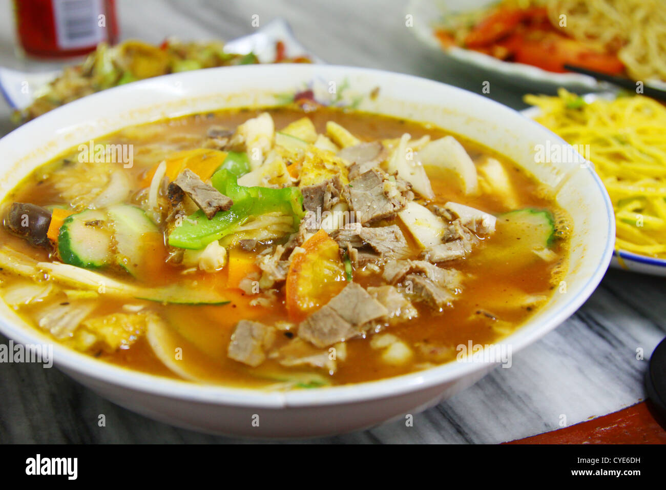 Chinese xinjiang style noodles with beef and bread inside Stock Photo ...