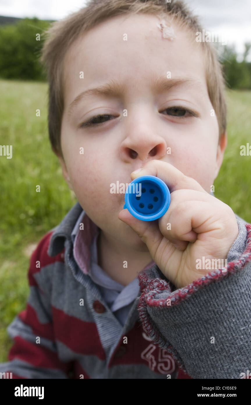 Blowing whistle kid hi-res stock photography and images - Alamy
