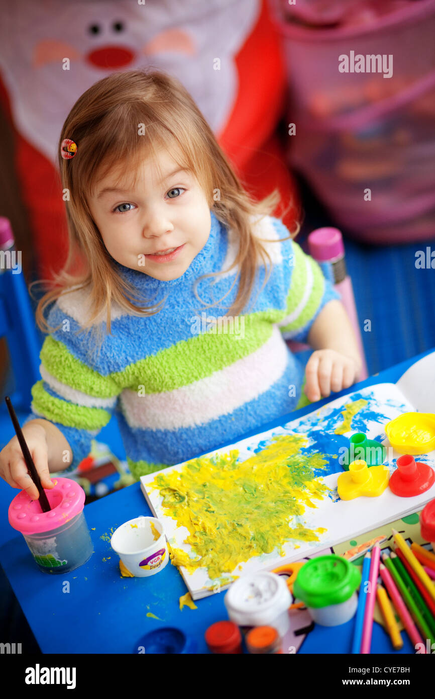 Little girl painting Stock Photo - Alamy
