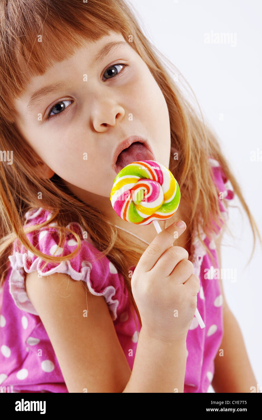 Beautiful child eating sweets hi-res stock photography and images - Alamy