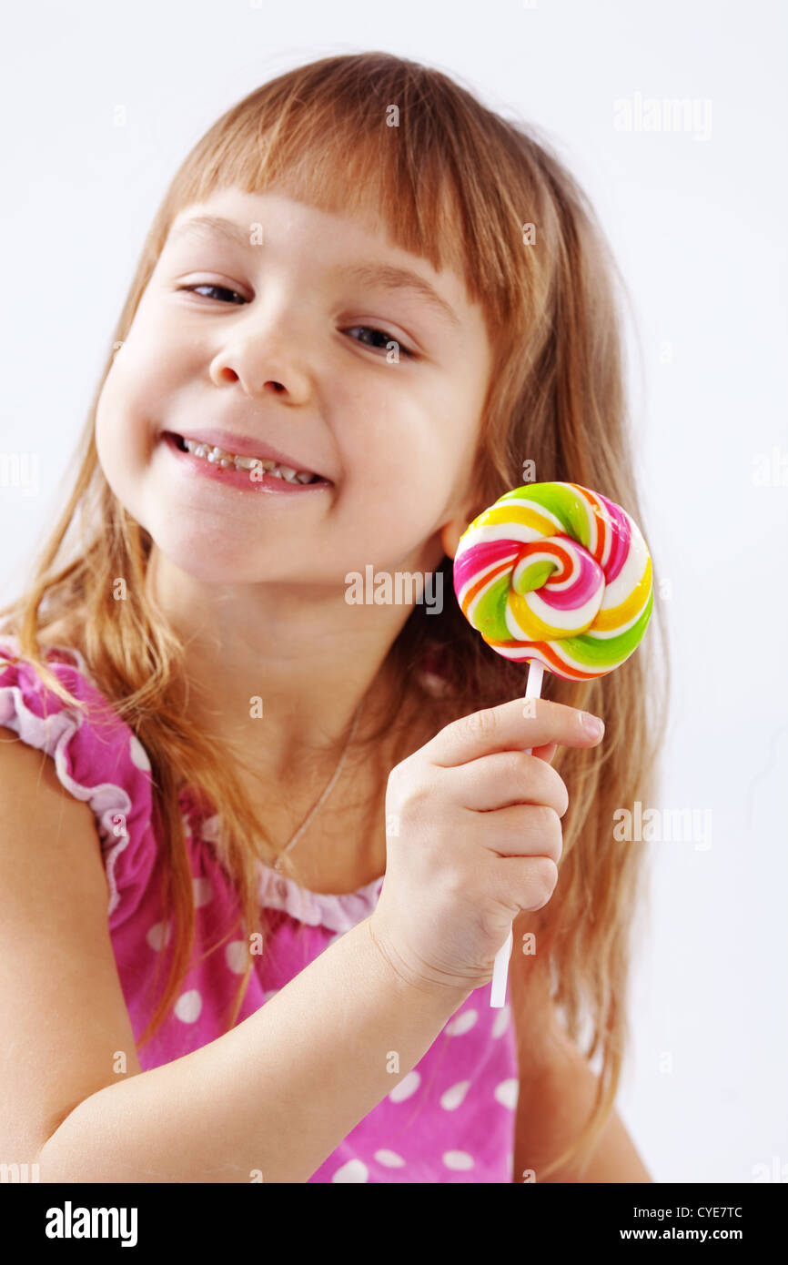 Beautiful child eating sweets hi-res stock photography and images - Alamy