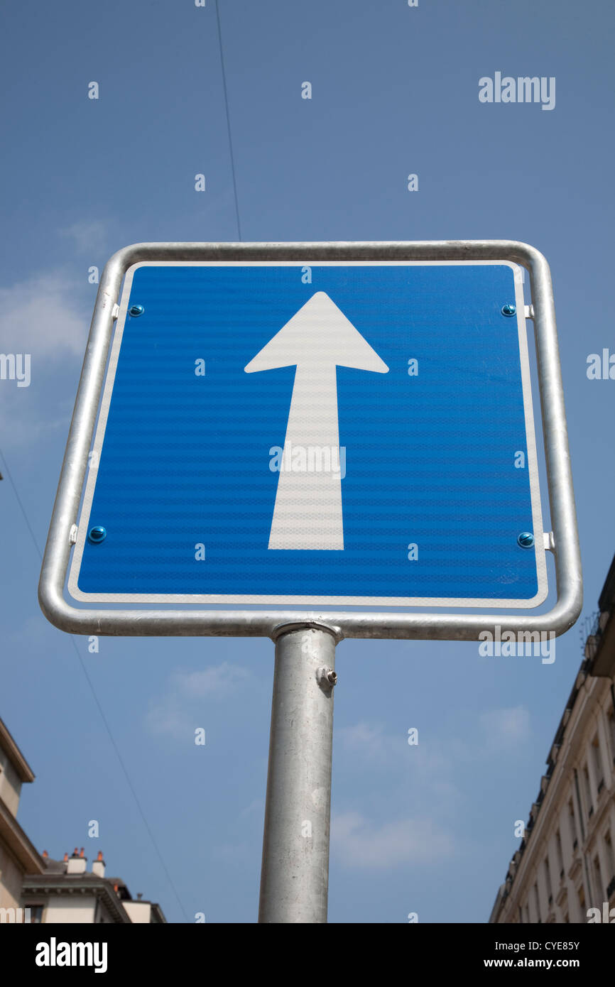 White Arrow One Way Sign on Blue Sky Background Stock Photo - Alamy