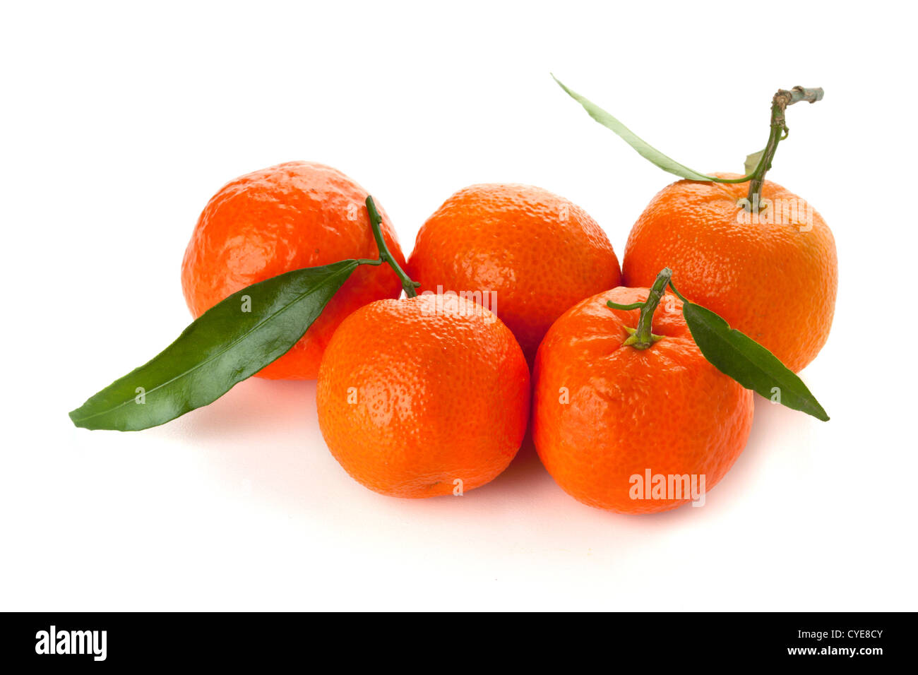 Five ripe tangerines with leafs. Isolated on white Stock Photo - Alamy