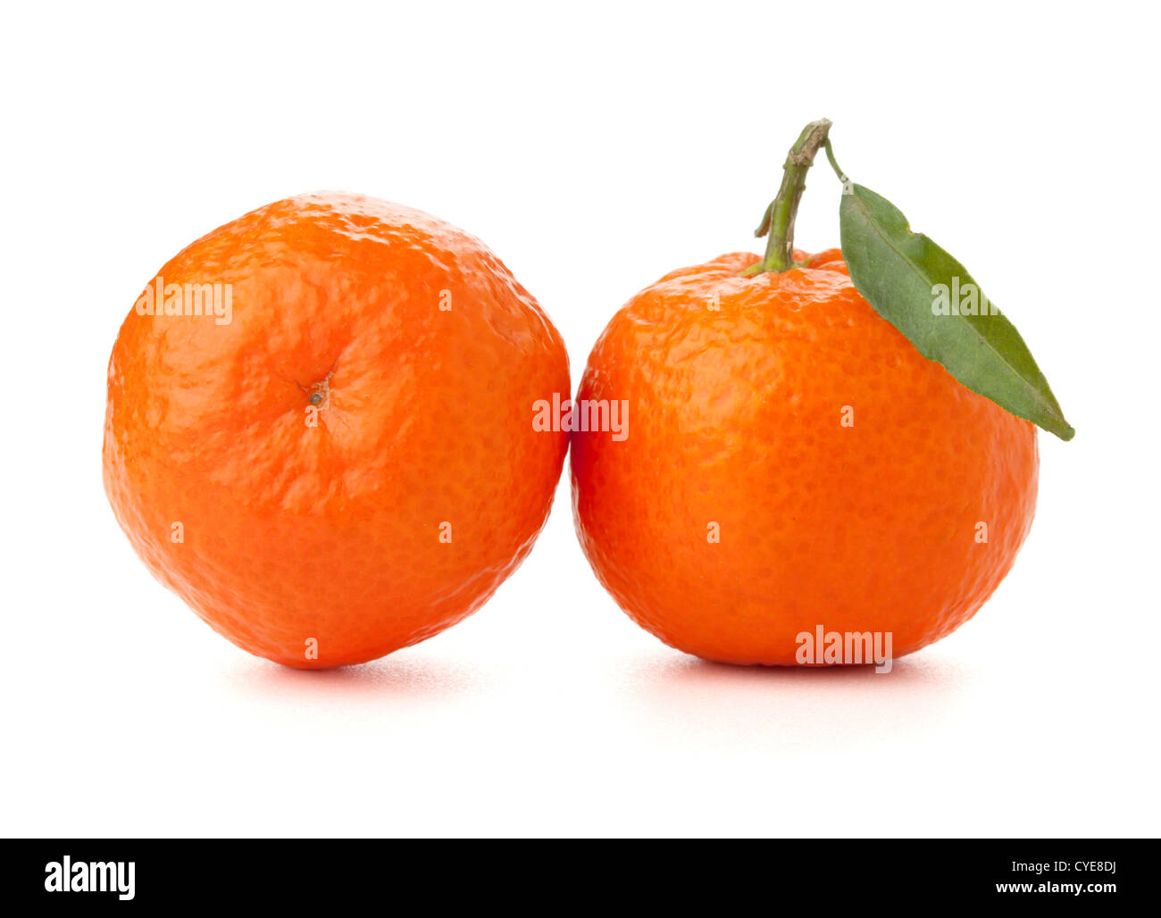 Two ripe tangerines with leafs. Isolated on white Stock Photo - Alamy