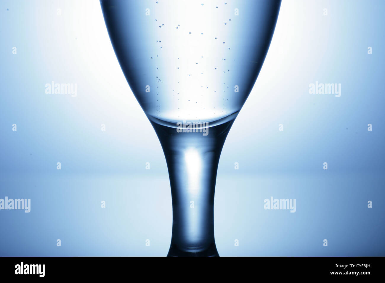 water glass on reflecting ground shimmering blue Stock Photo - Alamy