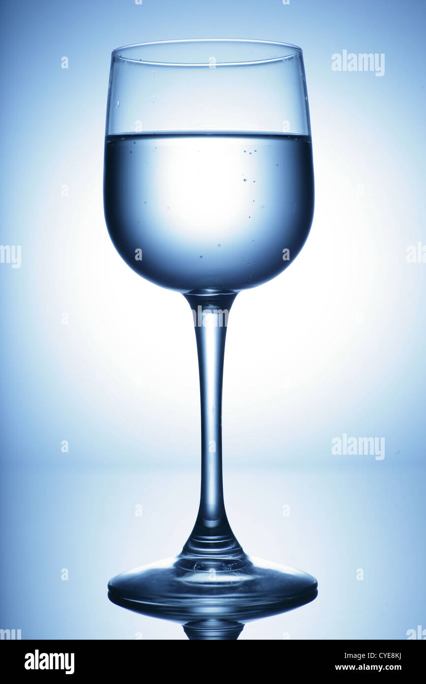water glass on reflecting ground shimmering blue Stock Photo - Alamy