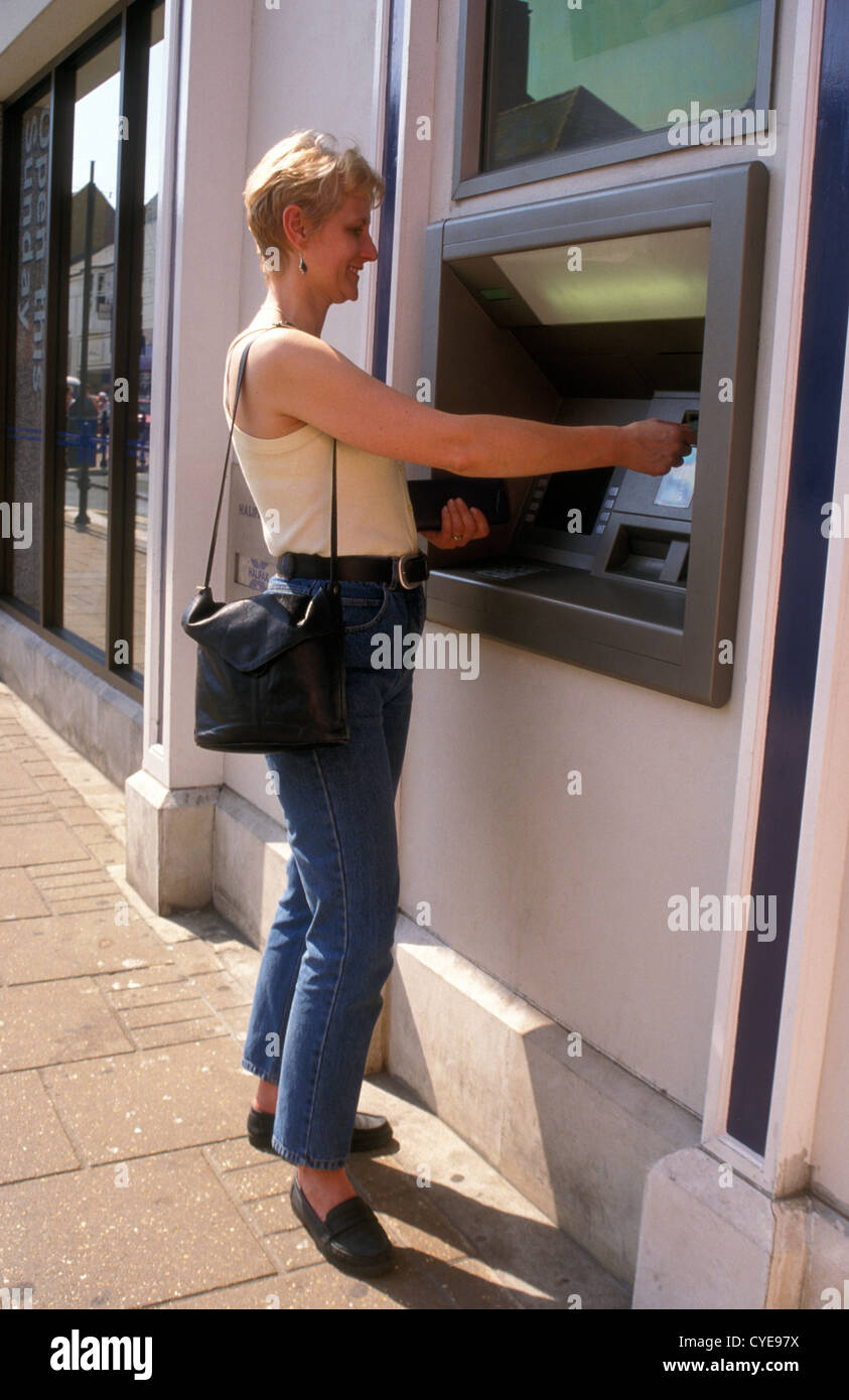 woman at cashpoint Stock Photo - Alamy