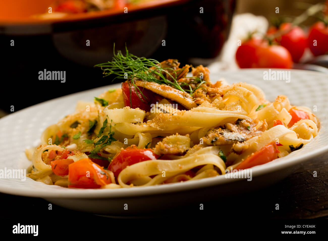 Italian regional dish made of pasta with sardines on wooden table Stock ...