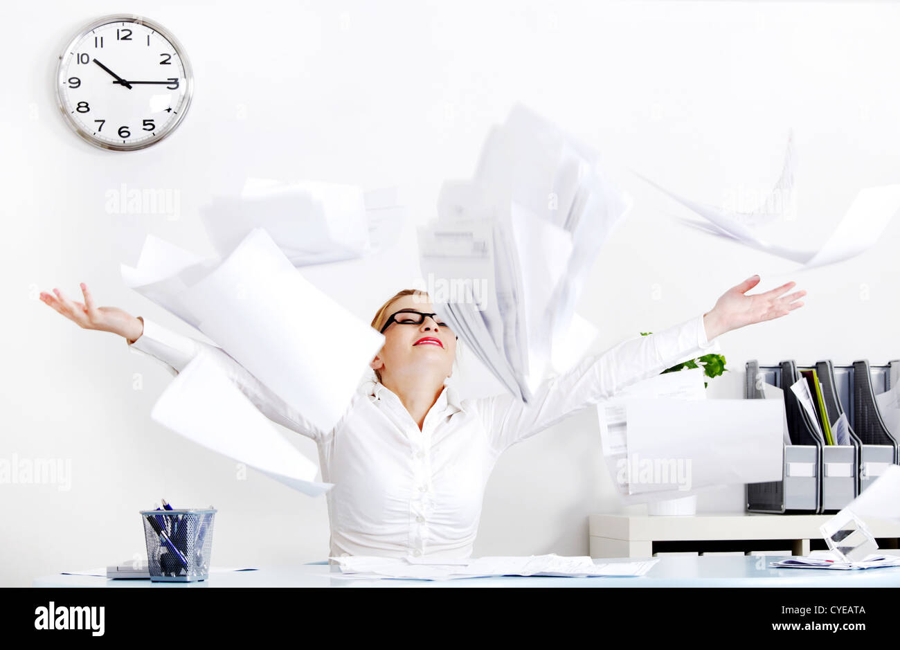 Businesswoman throwing files Stock Photo - Alamy