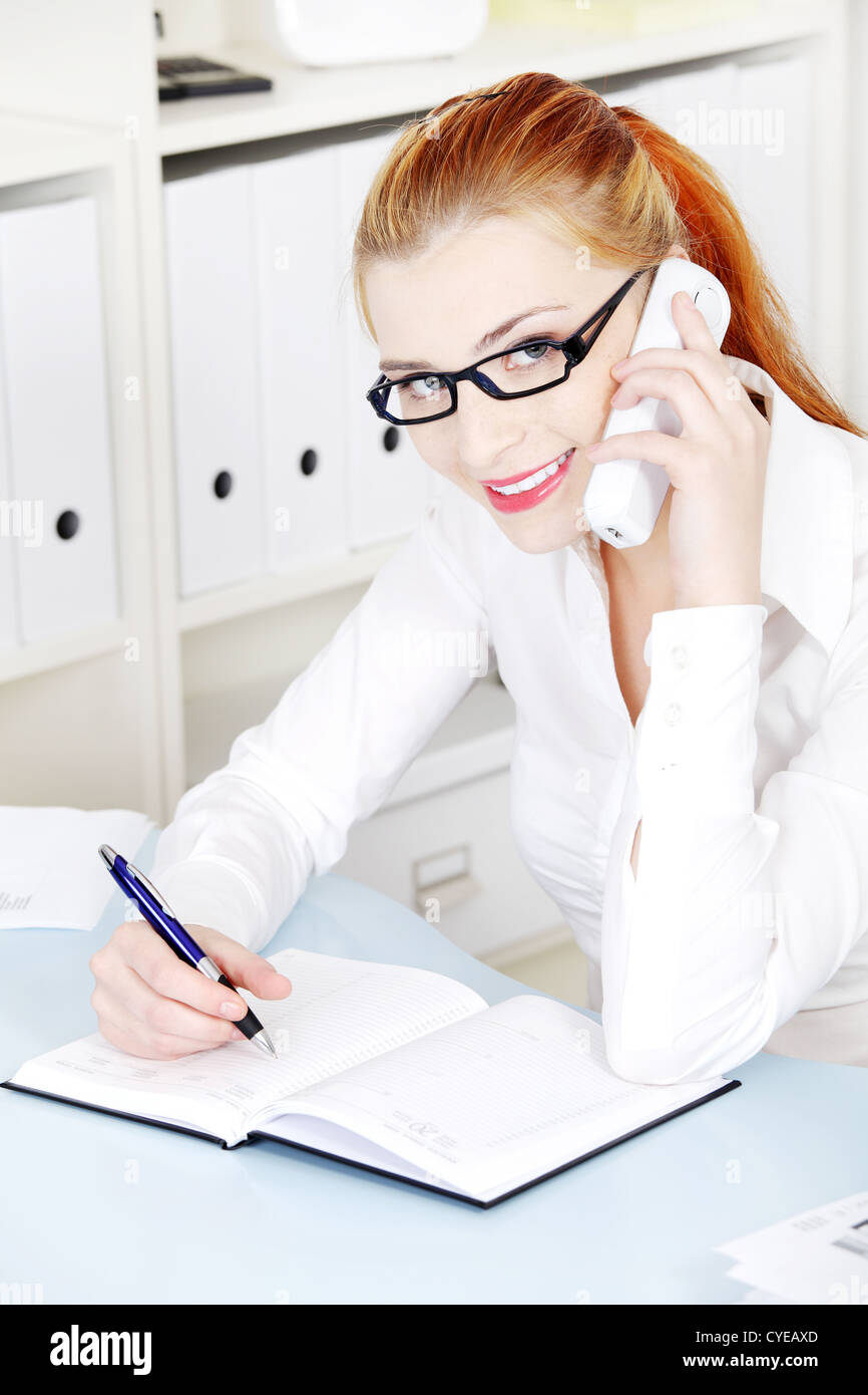 Pretty girl answering phone in hi-res stock photography and images - Alamy