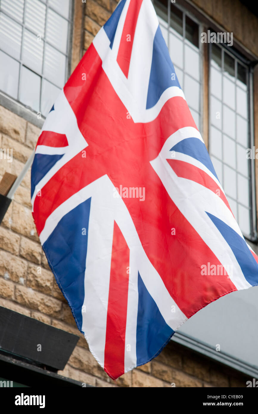 Union Jack Flag hanging outside Building Stock Photo - Alamy