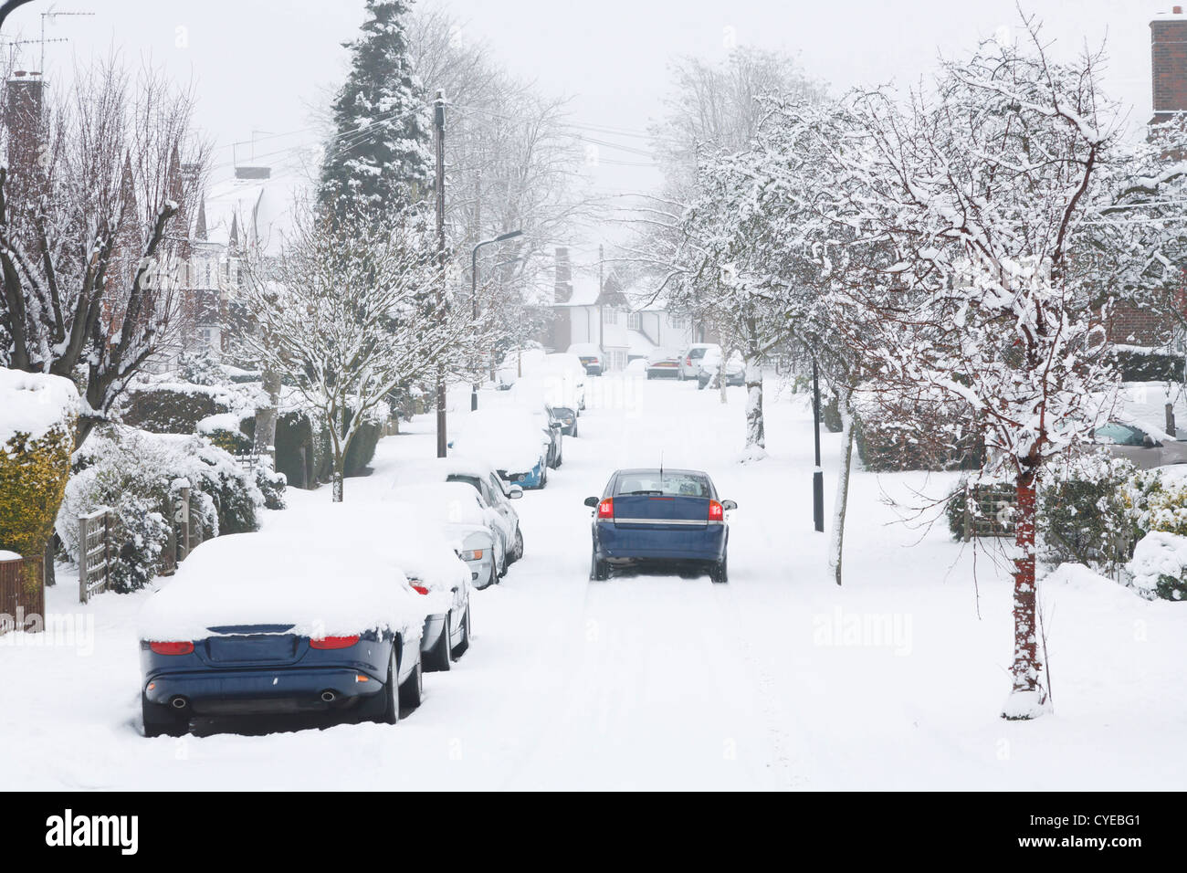 Dangerous driving conditions after snowfall in Pinner, UK Stock Photo ...