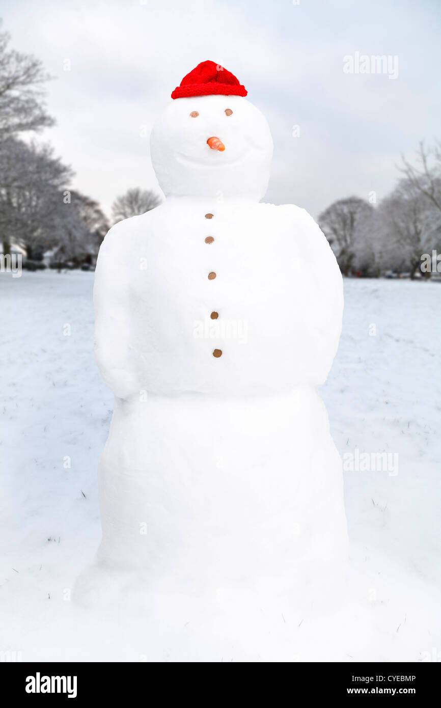 Winter landscape with snowman on a village green in England, UK Stock ...
