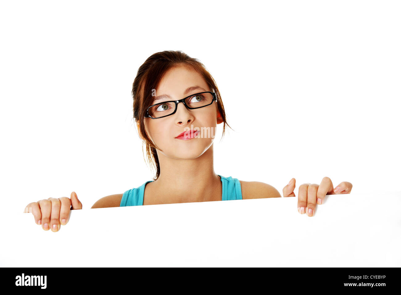Young teen student hiding behind sheet of paper Stock Photo - Alamy