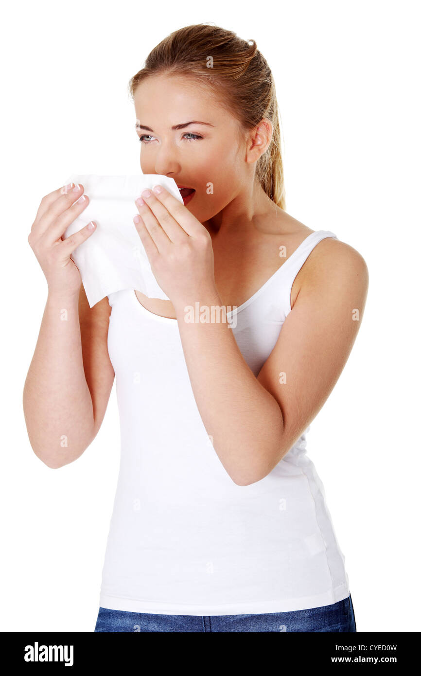 Blonde girl sneezing Stock Photo - Alamy