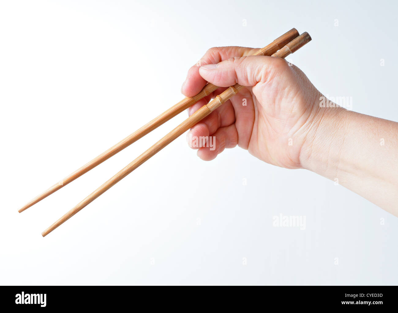 hand using chopsticks Stock Photo - Alamy