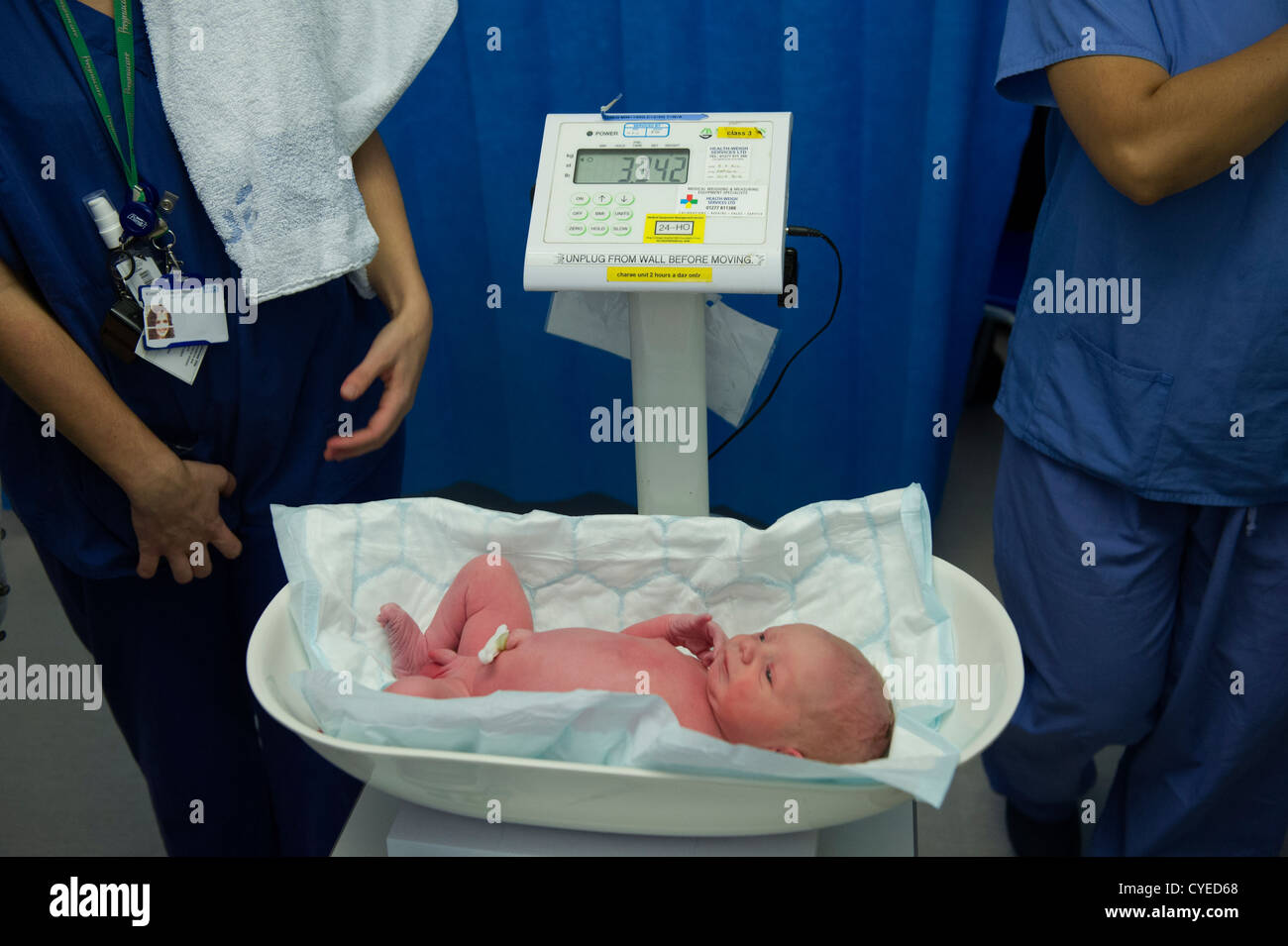 A new born baby moments after it was delivered by Cesarean section ...