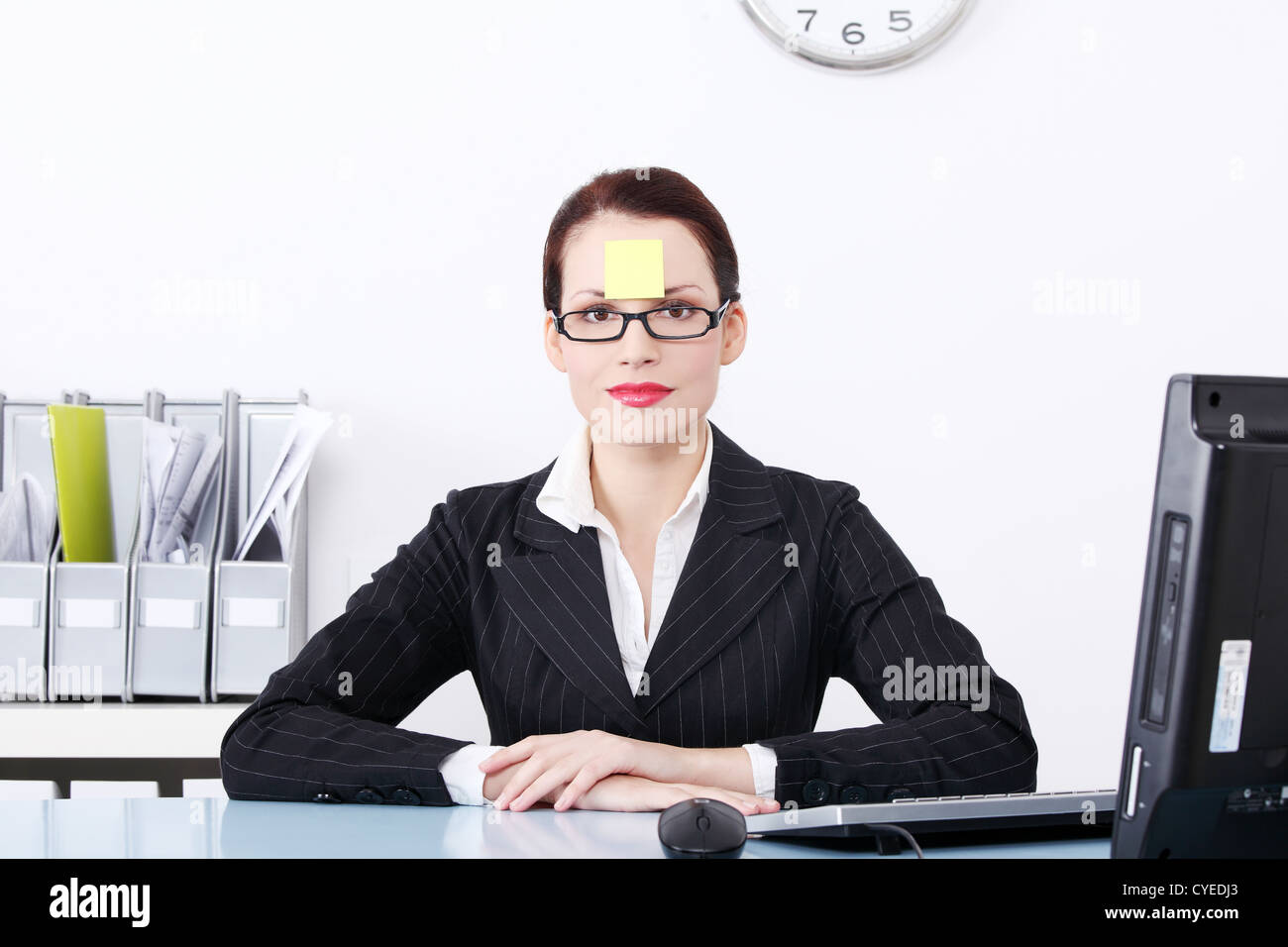 Pretty caucasian businesswoman sitting in the office with post it note ...