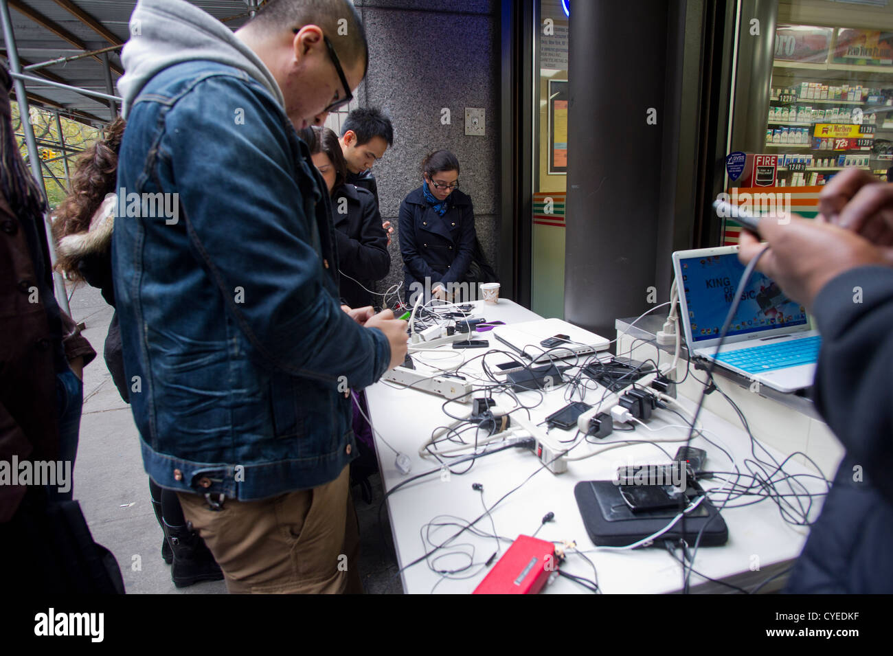 A 7-Eleven store sets up charging stations outside it's store for ...
