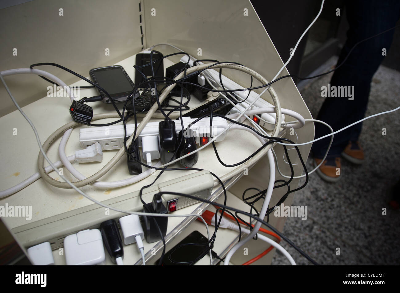 A 7-Eleven store sets up charging stations outside it's store for ...