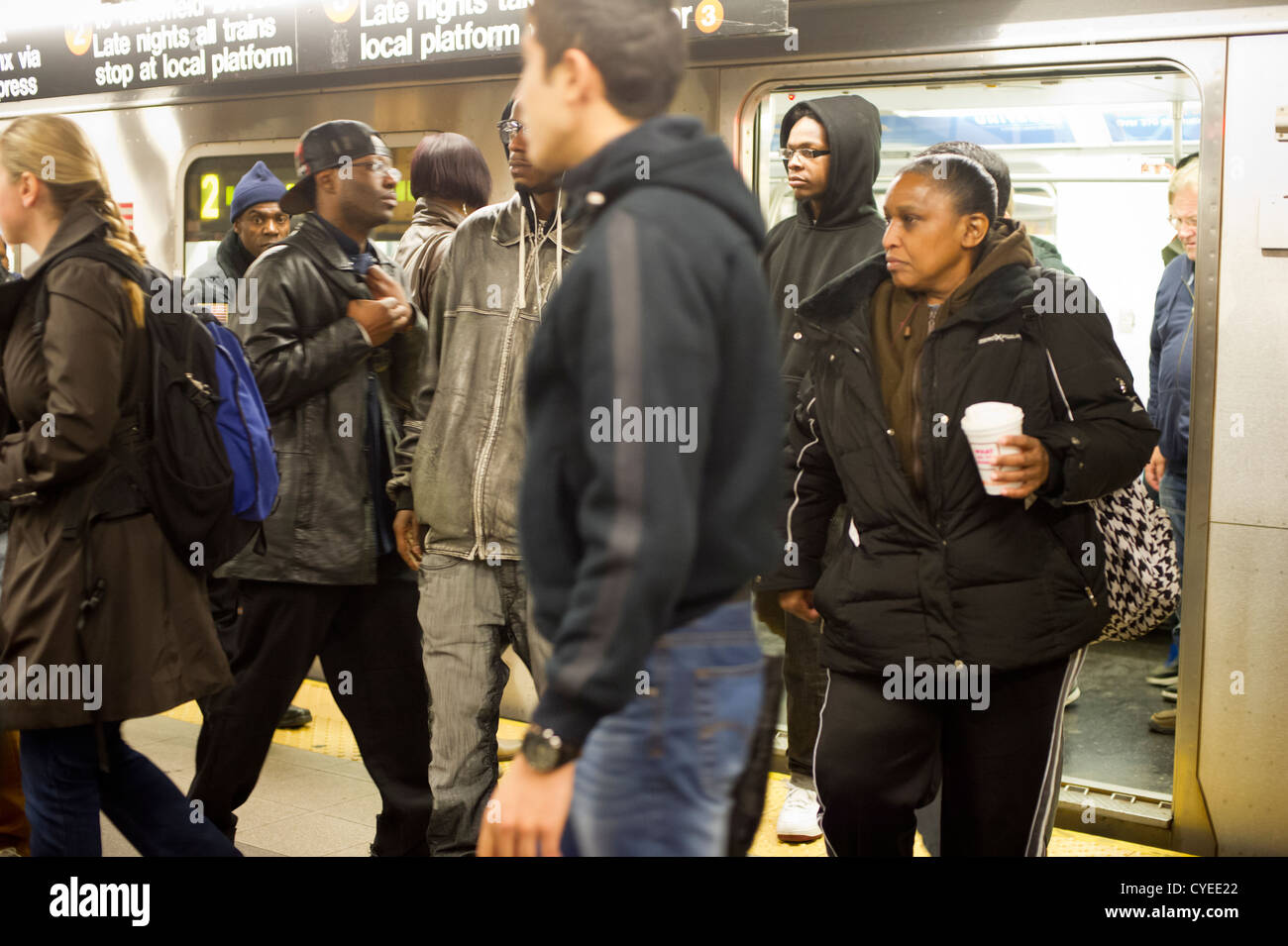 Commuters in New York arrive at Penn Station on the IRT subway line ...