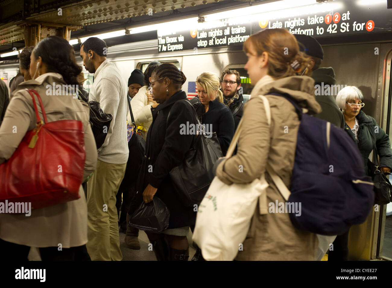 Commuters in New York arrive at Penn Station on the IRT subway line ...