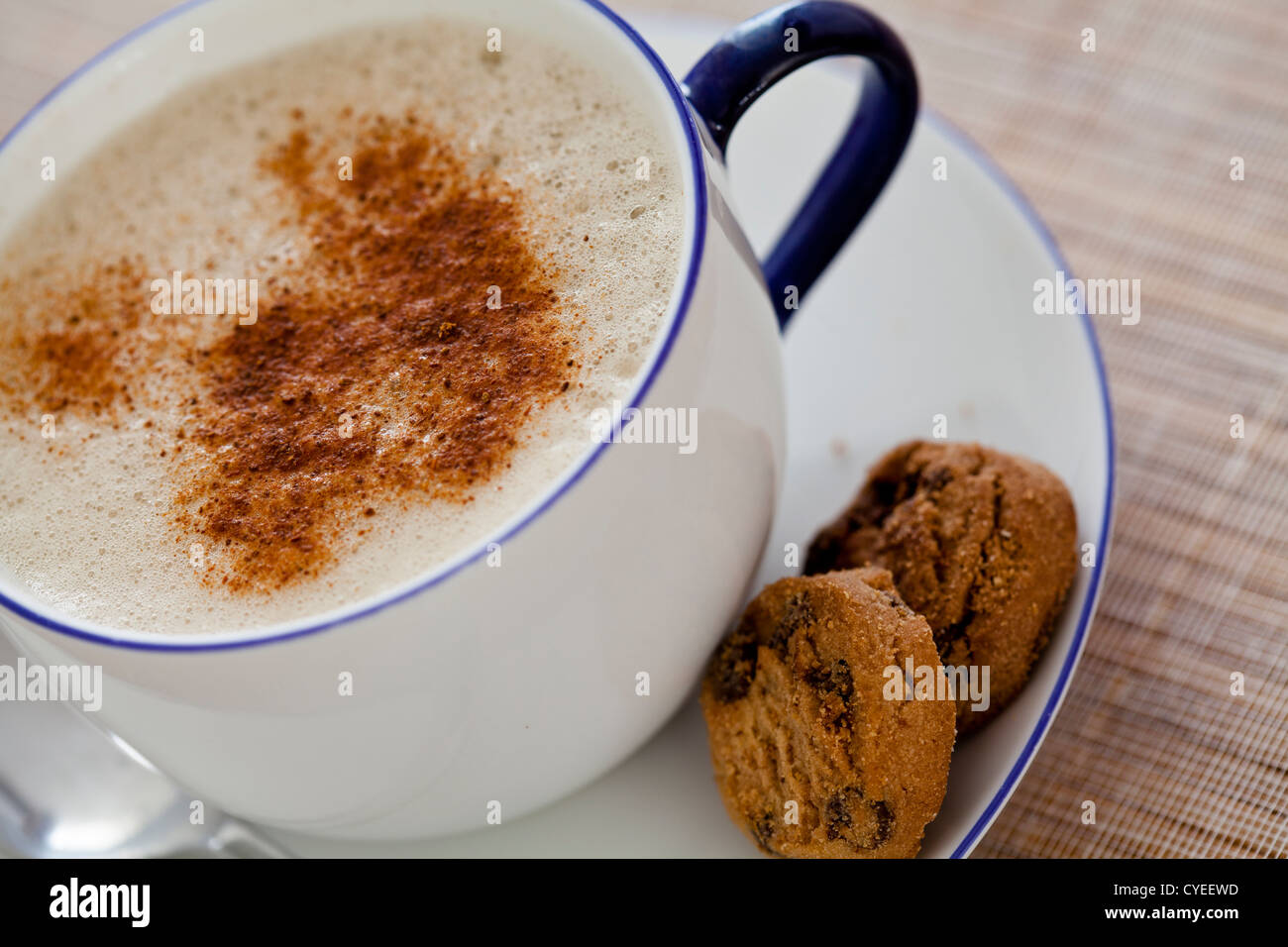 Close-up photograph of a cappuccino and sweets Stock Photo - Alamy